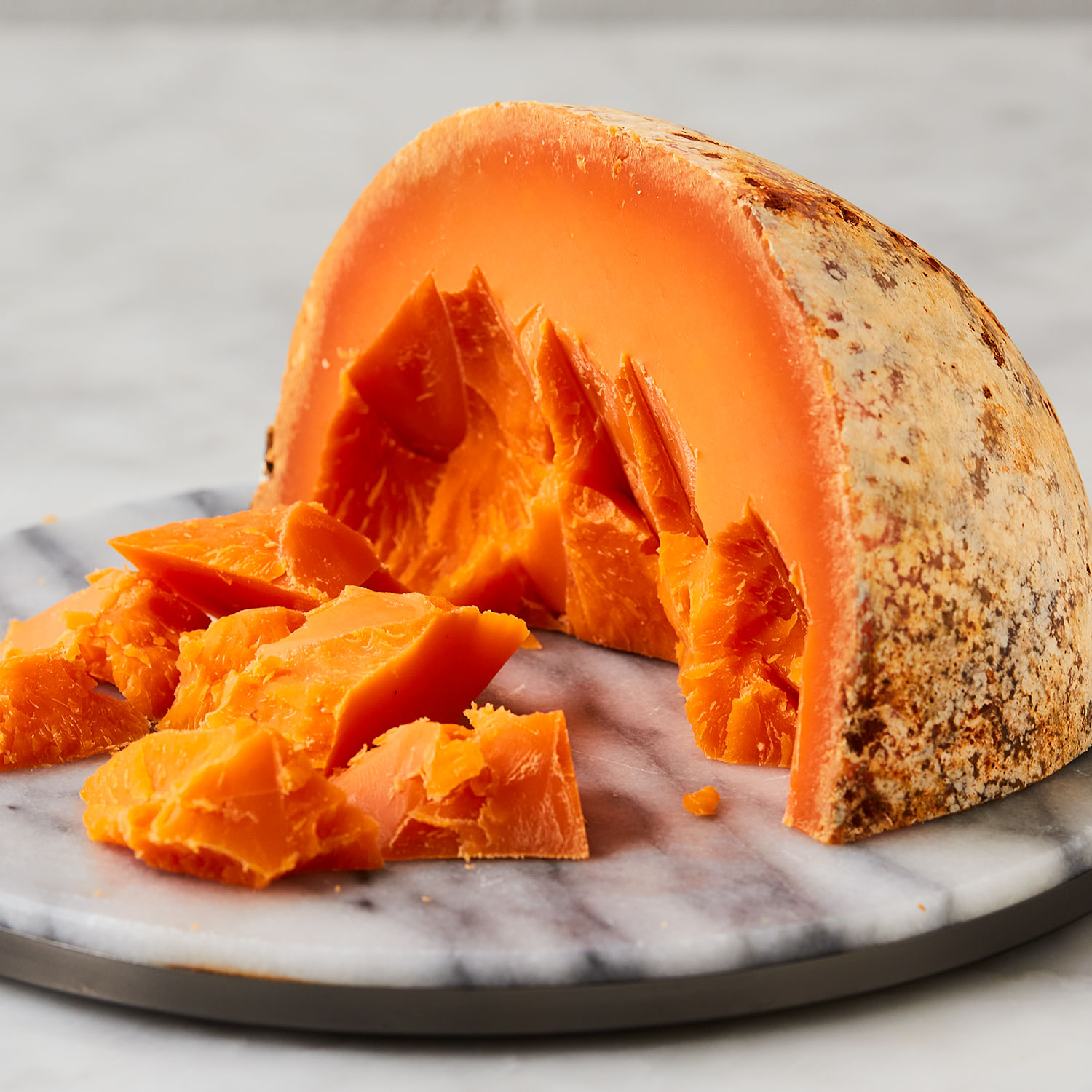 Mimolette 18 Month – a rich, orange, caramelly cow’s milk cheese | Murray's Cheese